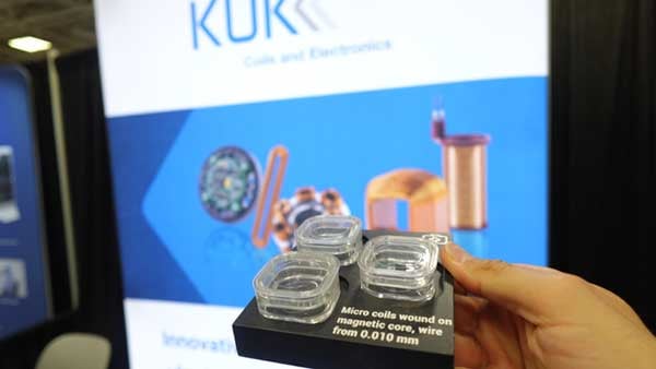 Which factors determine the choice of core material for micro coils?